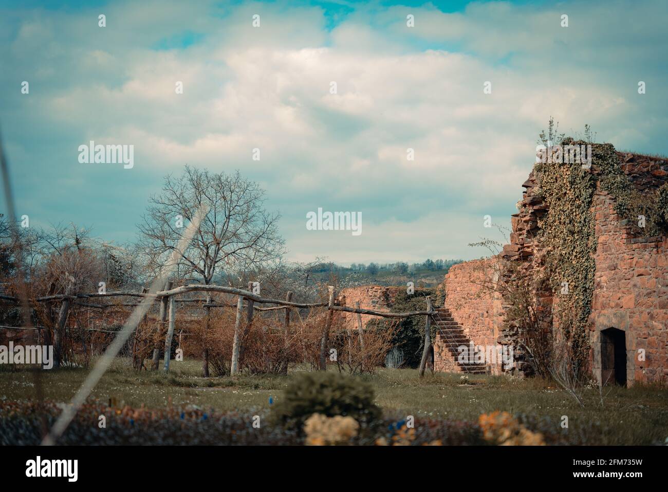 Old brick monastery in ruins under a bright cloudy sky Stock Photo - Alamy