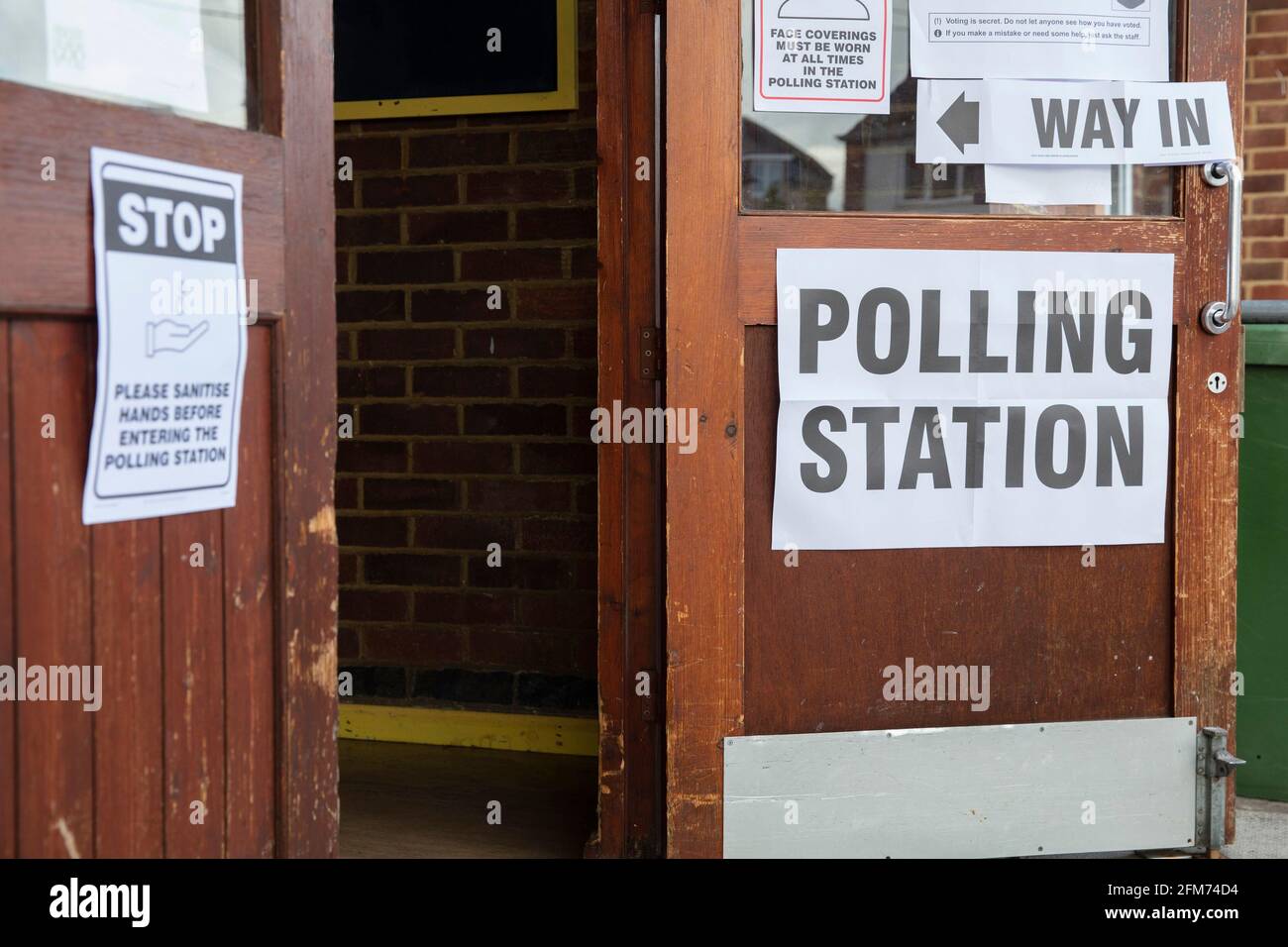 Polling station sign outside the entrance to a political voting ...