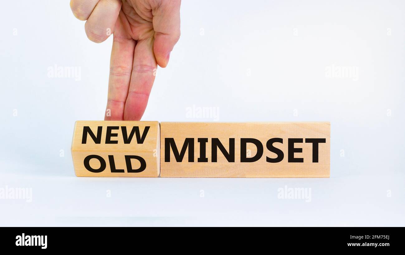 New vs old mindset symbol. Businessman turns the wooden block and ...
