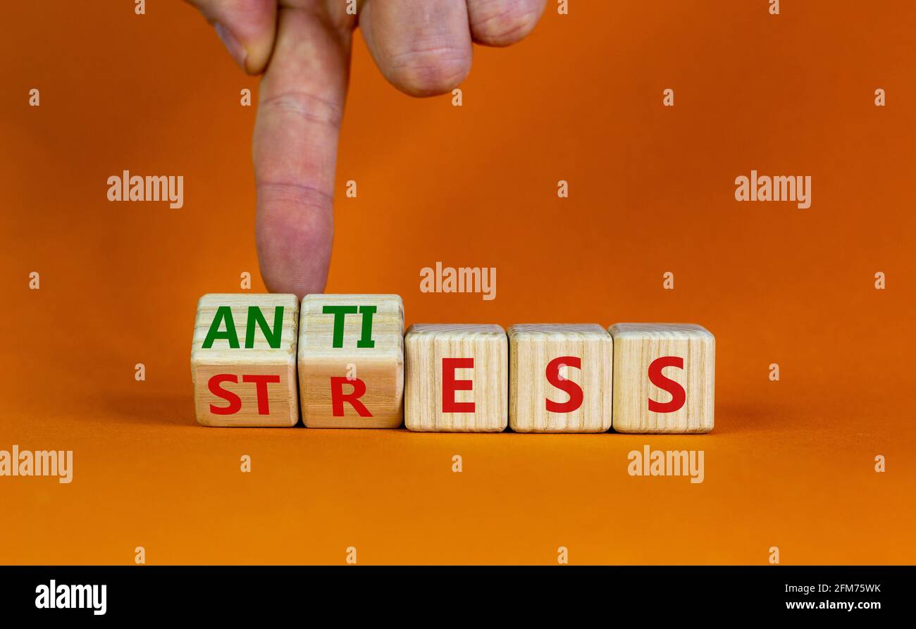 Antistress vs stress symbol. Doctor turns cubes and changes the word ...