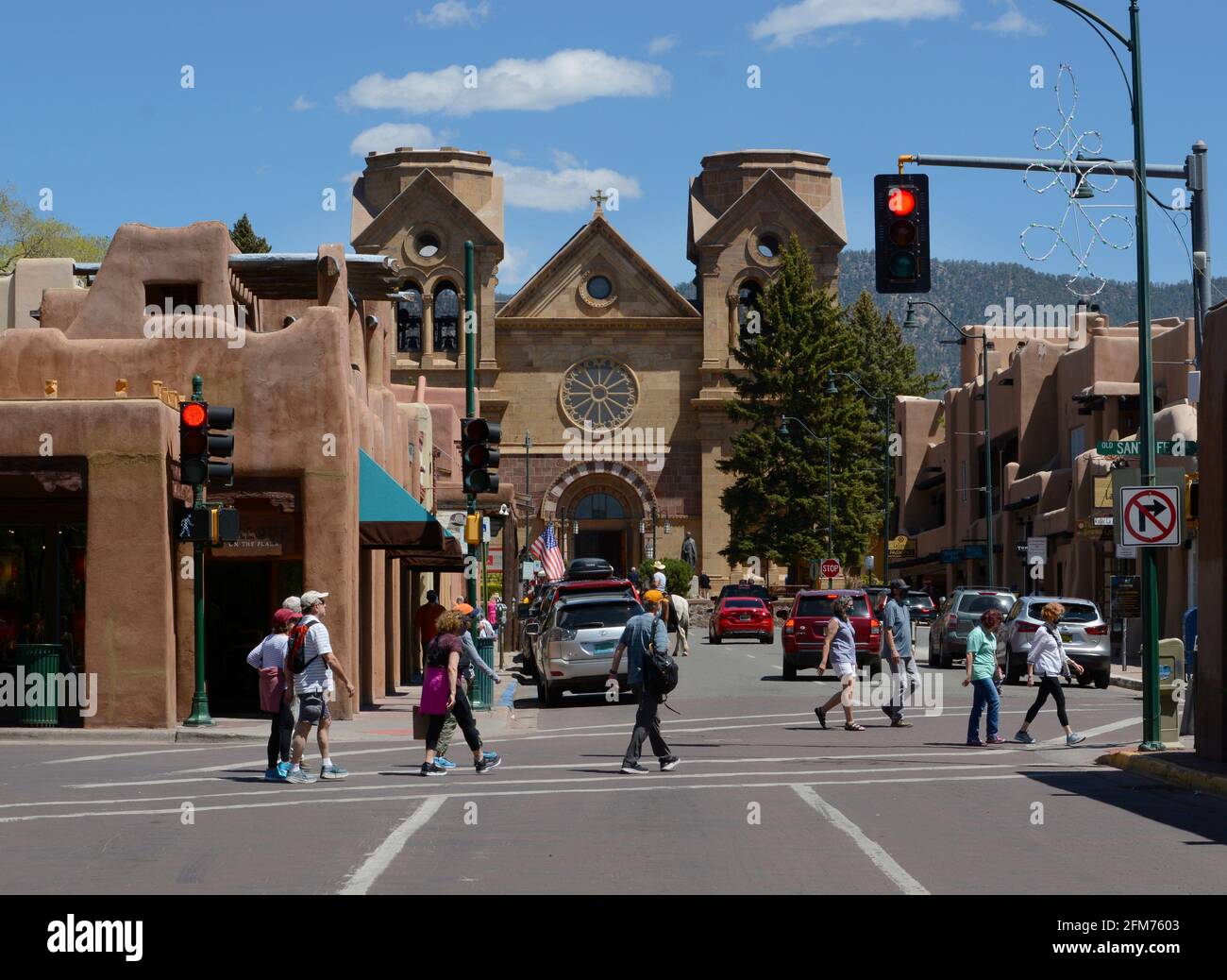 Tourists and shoppers cross a street in downtown Santa Fe, New Mexico ...
