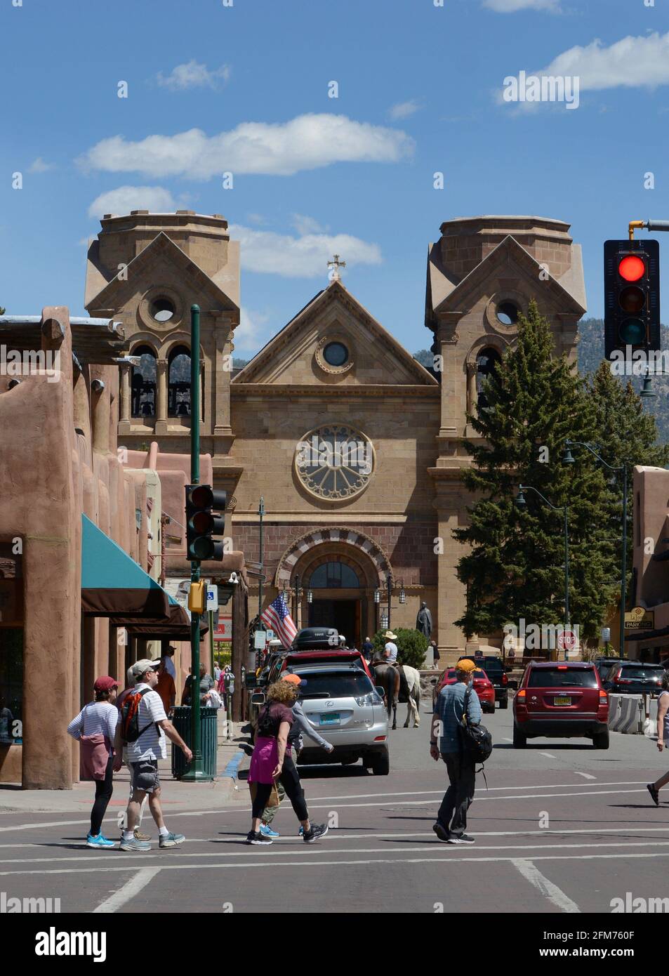 Tourists and shoppers cross a street in downtown Santa Fe, New Mexico ...