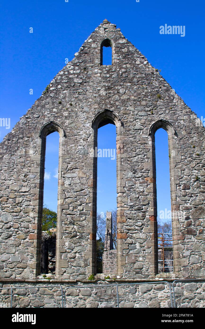 The gable wall of the ruins of the historic Greyabbey Monastery that ...