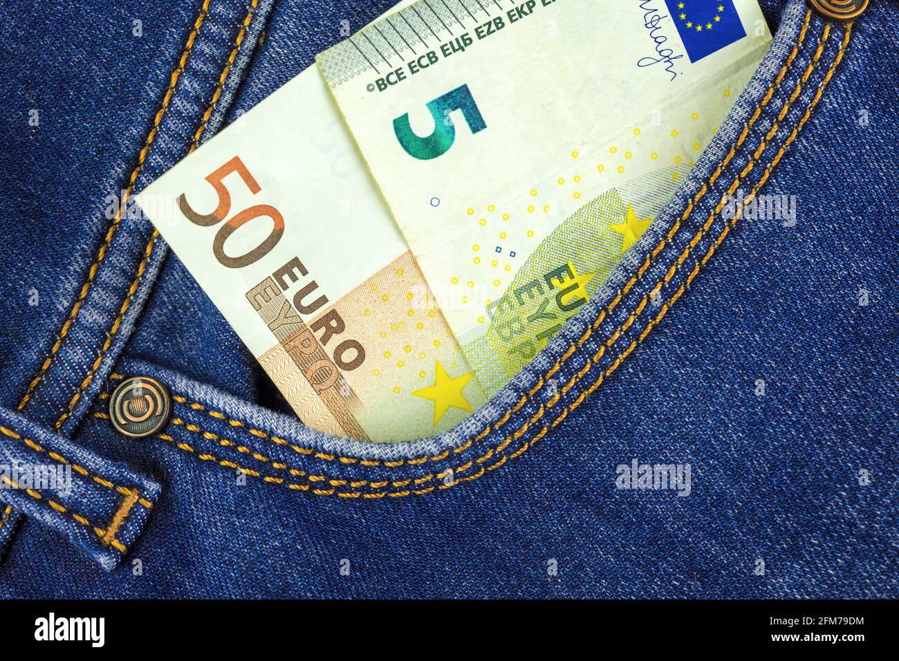 Euro banknotes in a pocket of blue jeans close-up photo, business money ...