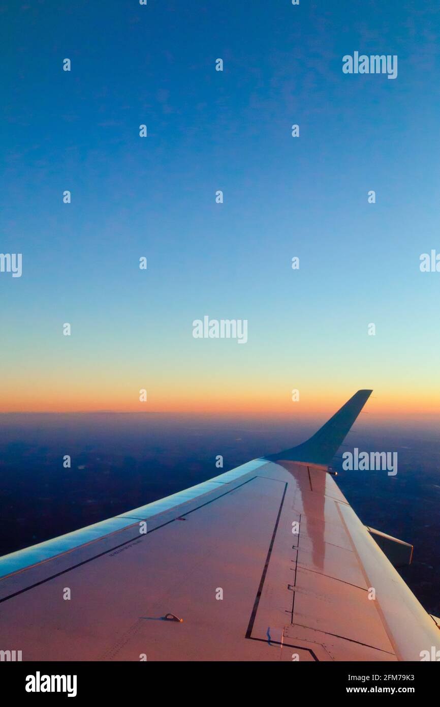 sunrise/sunset view of the colorful horizon from the airplane window ...