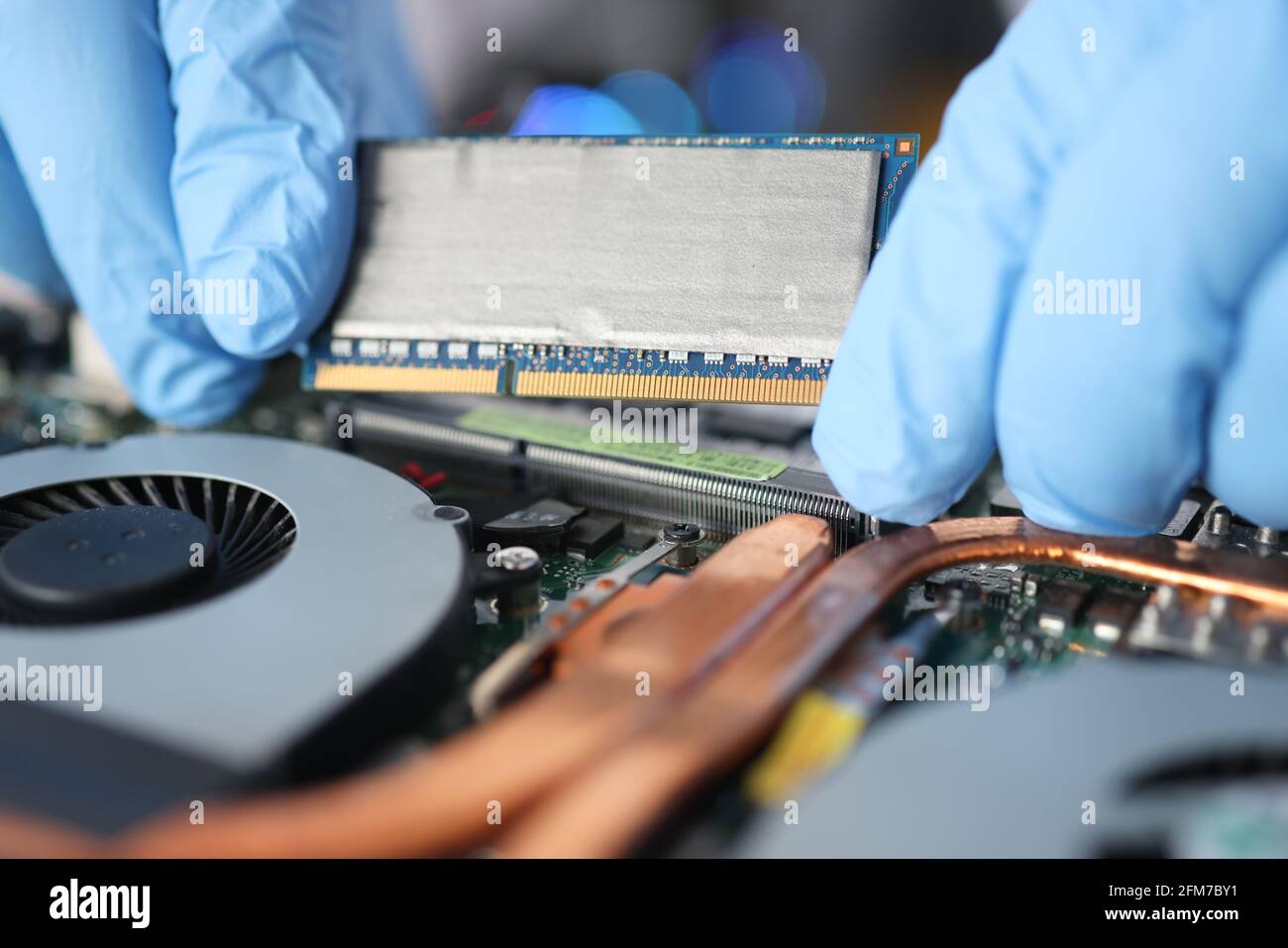 Replacing computer board in a laptop closeup Stock Photo - Alamy