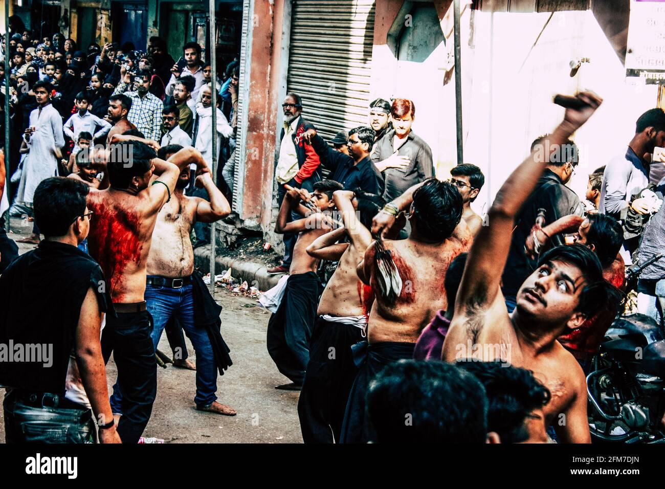 Shiite Muslims people using chains and blades during a ritual self ...