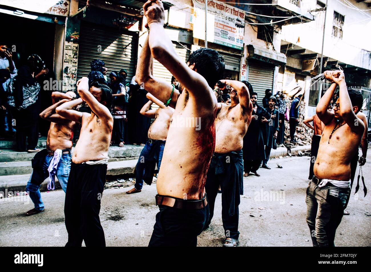Shiite Muslims people using chains and blades during a ritual self ...