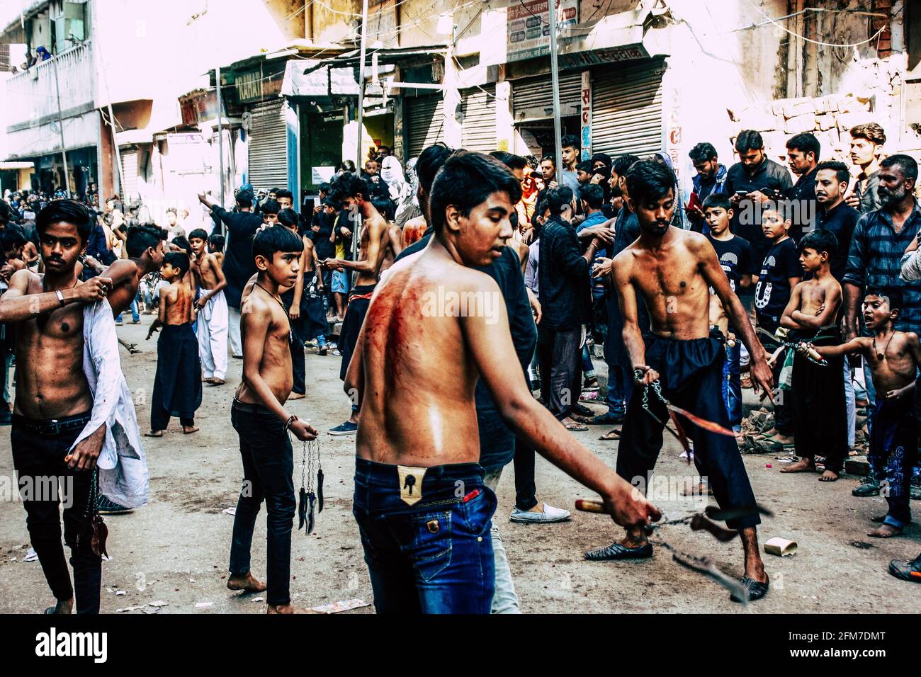 Shiite Muslims people using chains and blades during a ritual self ...