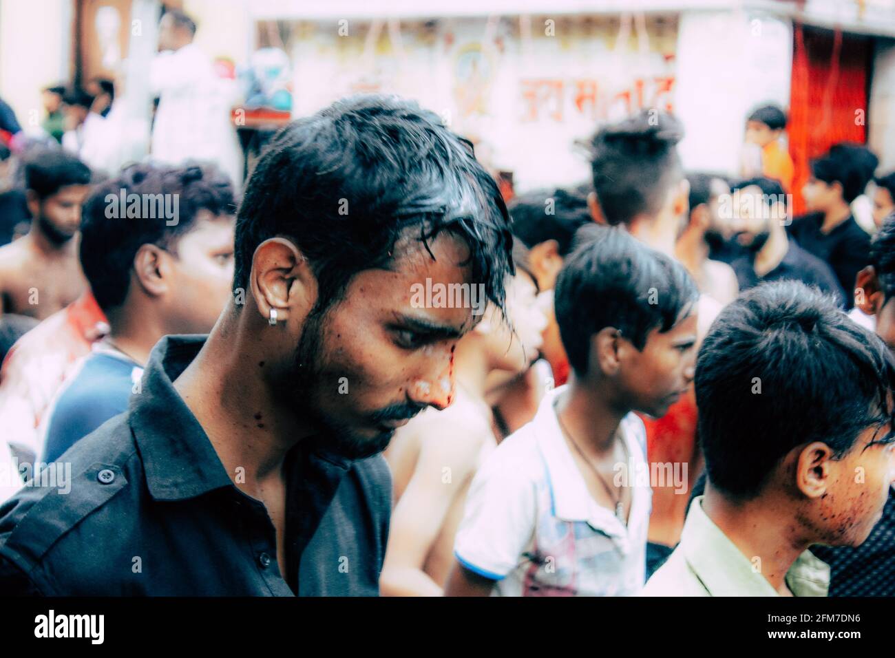 Shiite Muslims people using chains and blades during a ritual self ...