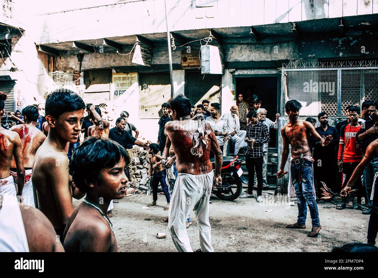 Shiite Muslims people using chains and blades during a ritual self ...