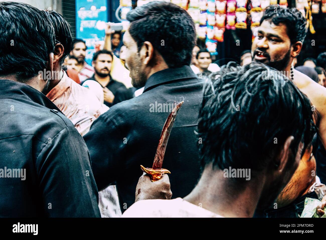 Shiite Muslims people using chains and blades during a ritual self ...