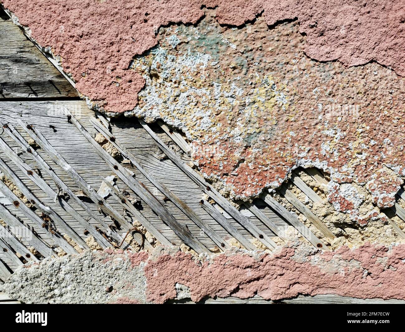 Destroyed wall with wooden tiles Stock Photo - Alamy