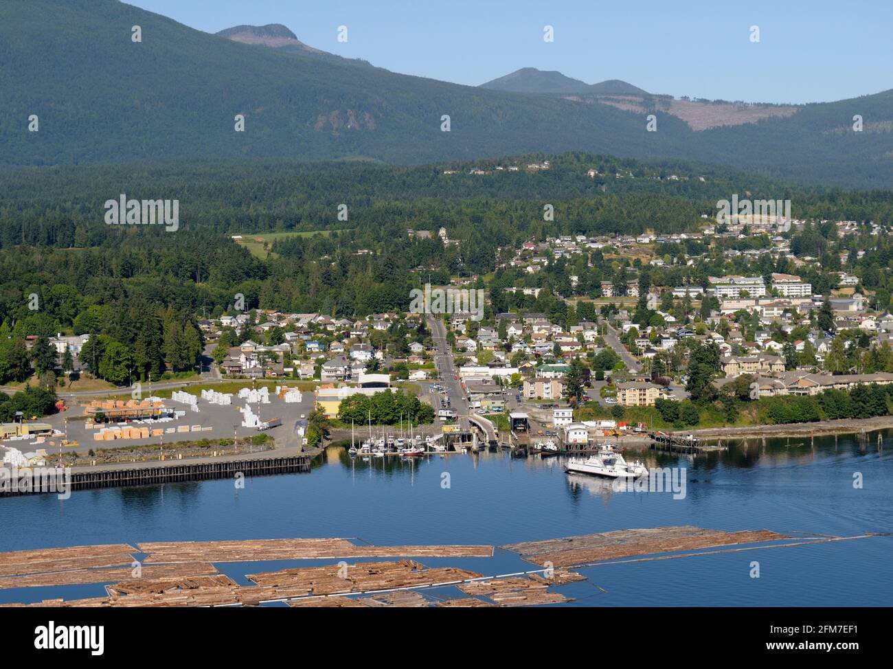 BC Ferry Kuper approaching the town of Chemainus. The government wharf ...