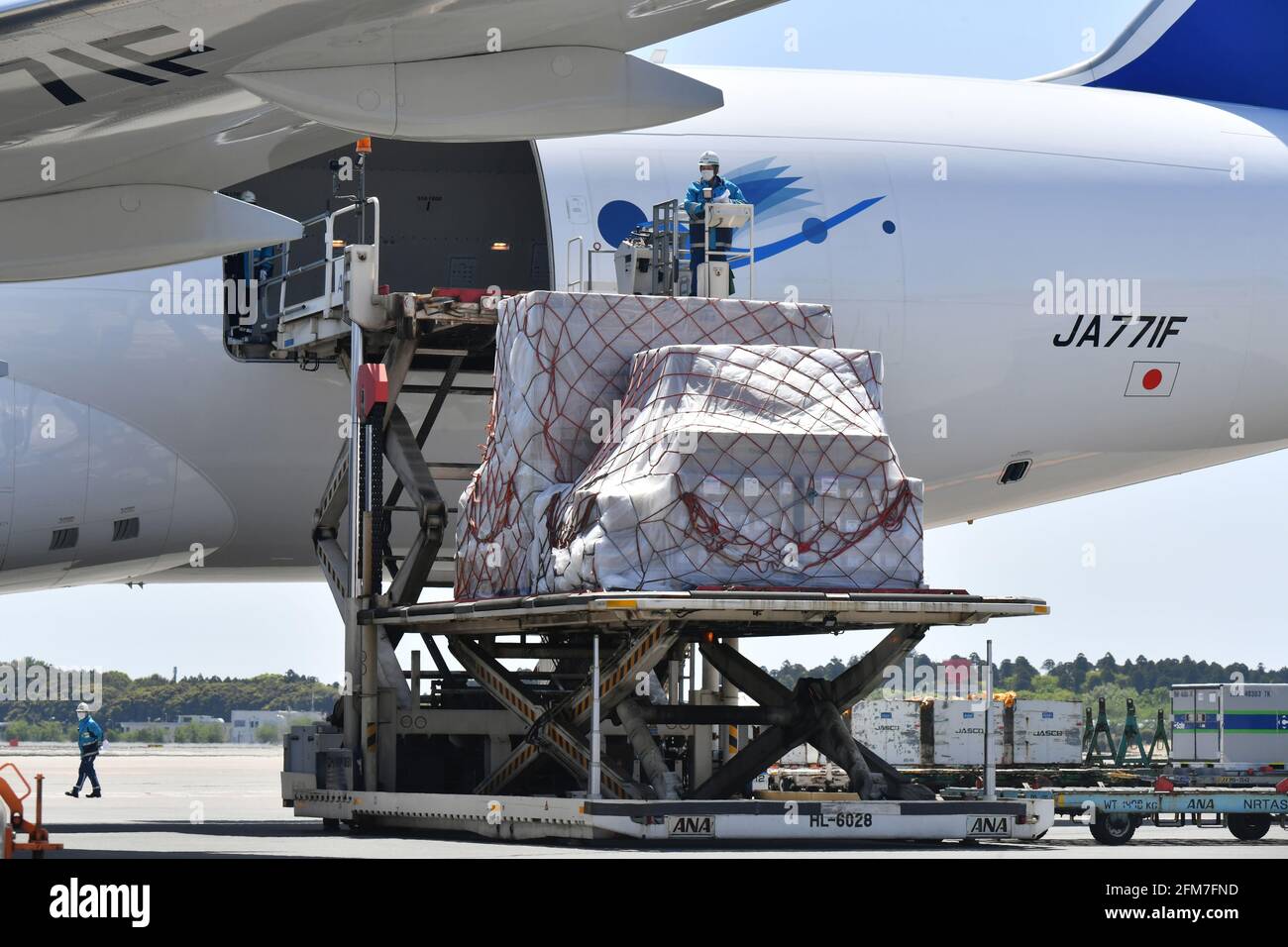 ANA 777F (JA771F) flight NH9646 to Los Angeles loading cargo at Narita ...