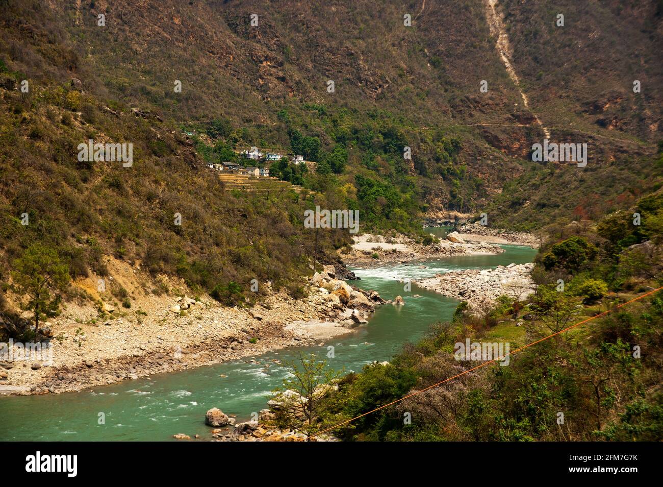 Remote villages on the Alaknanda river as seen by the road between ...