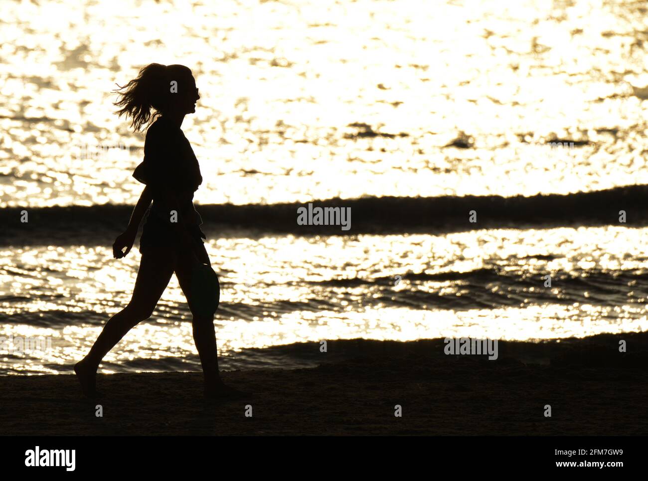 Woman beach paddle ball hi-res stock photography and images - Alamy