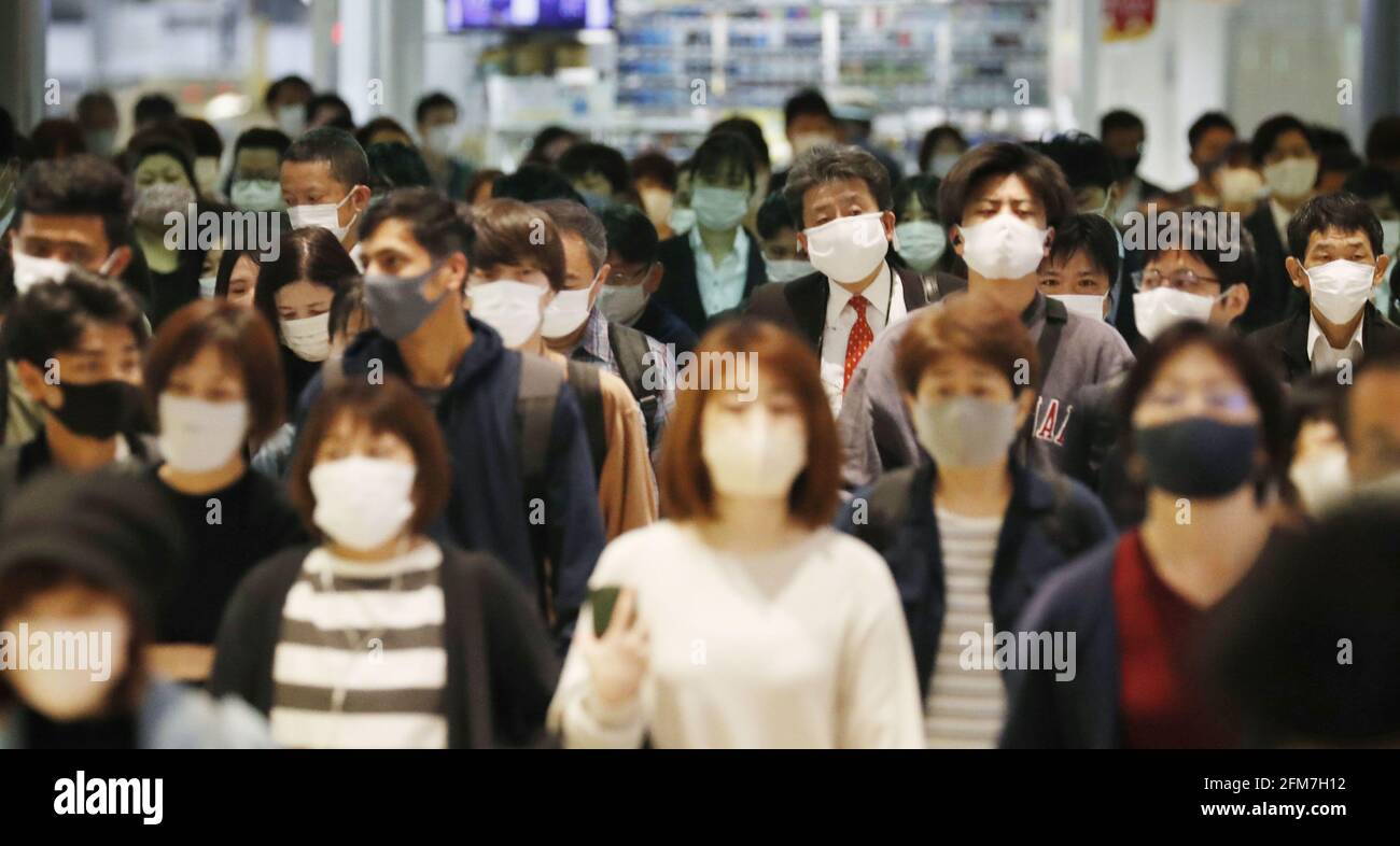 Fukuoka, Japan. May 7 2021: People wearing face masks walk at ...