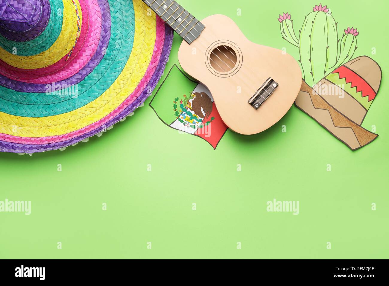 Sombrero hat with guitar and drawn symbols of Mexico on color ...