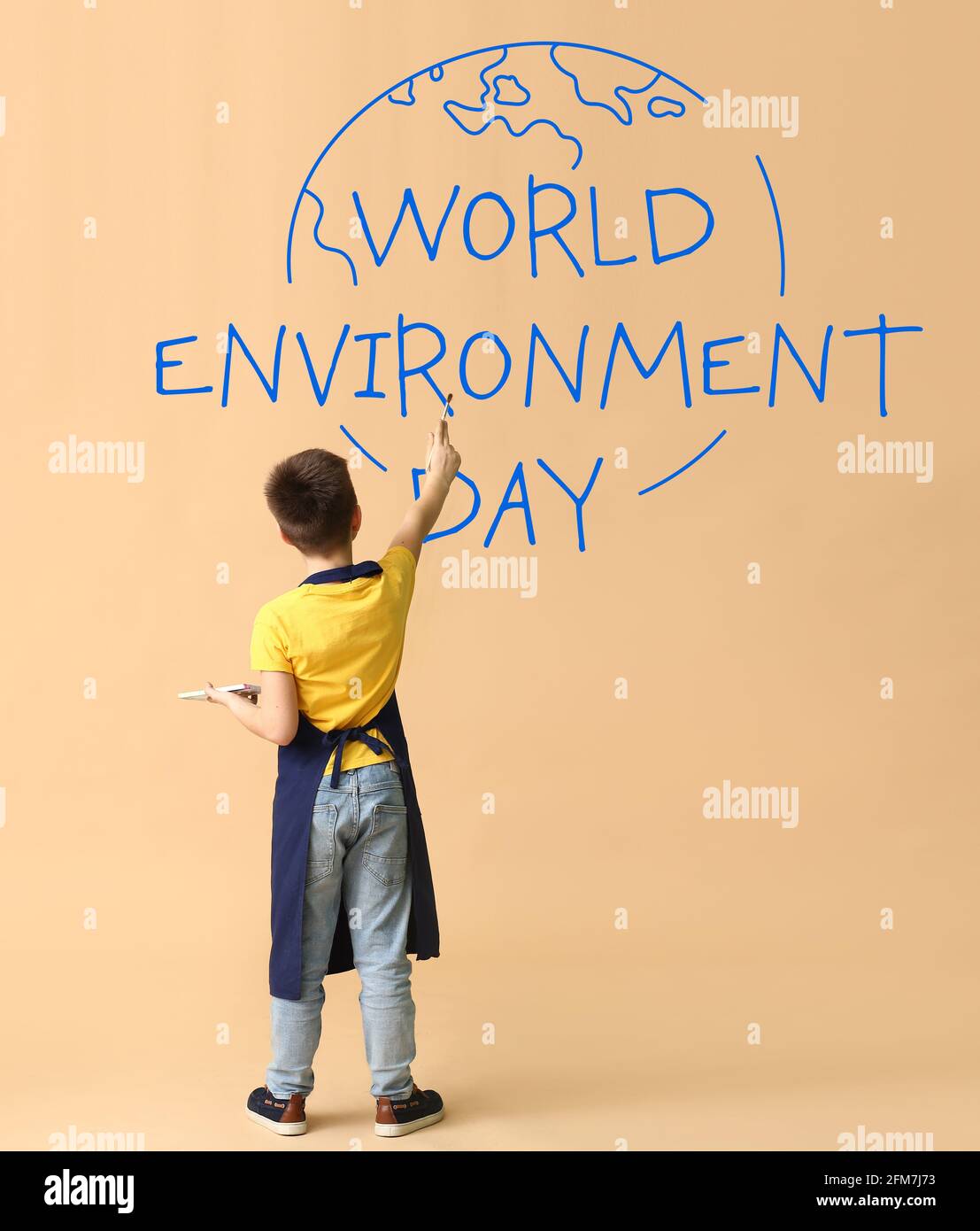 Little boy writing text WORLD ENVIRONMENT DAY on color background Stock ...