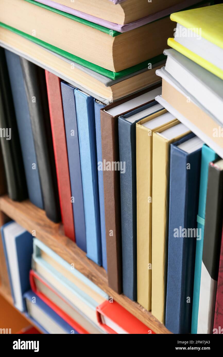 Shelf unit with books, closeup Stock Photo - Alamy