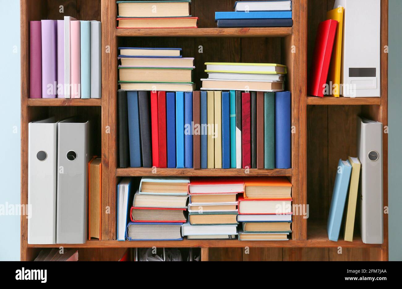 Shelf unit with books in library Stock Photo - Alamy