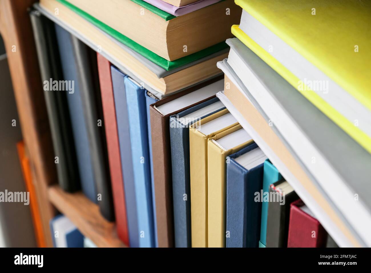 Shelf unit with books, closeup Stock Photo - Alamy