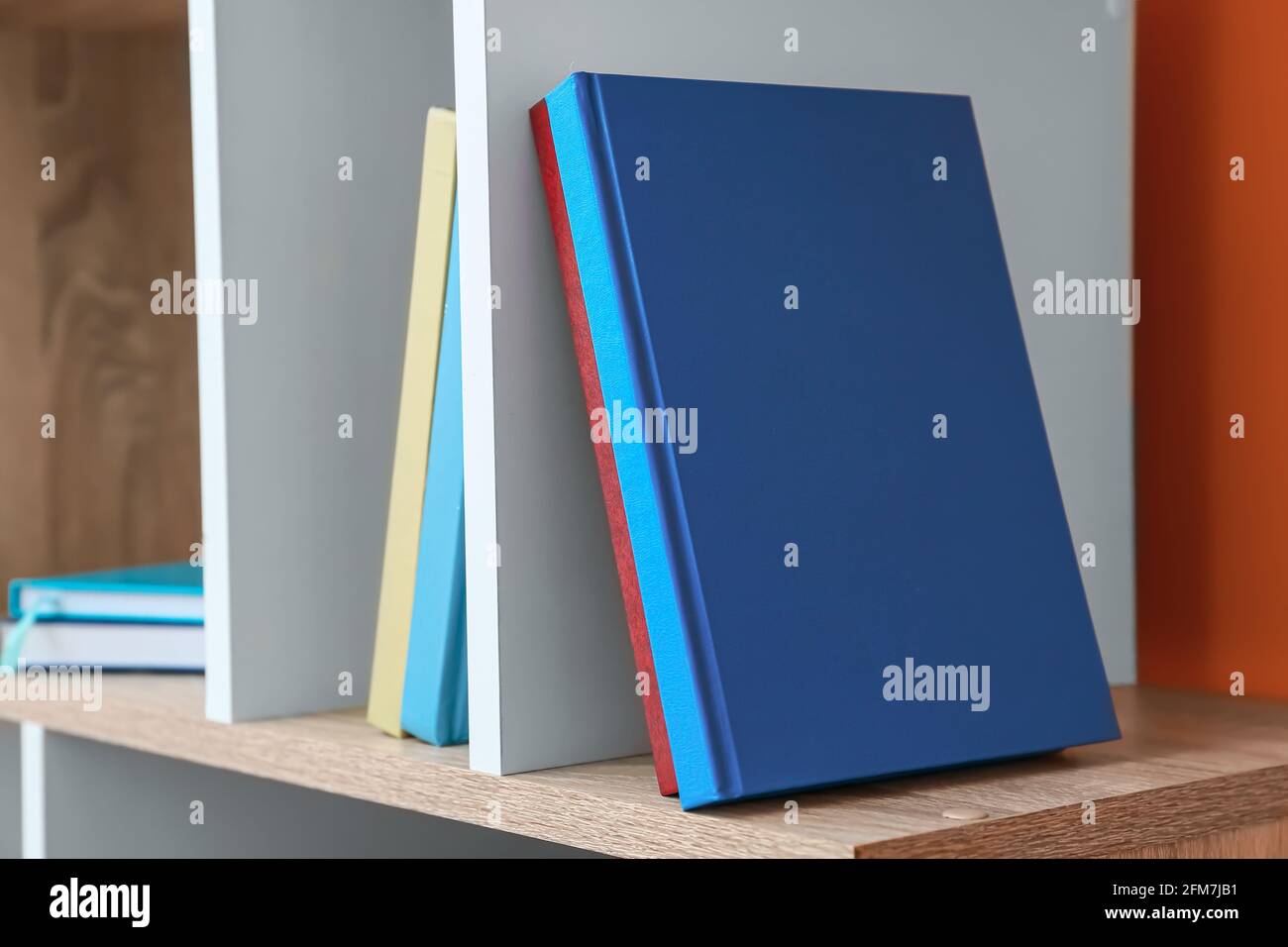 Shelf unit with books, closeup Stock Photo - Alamy