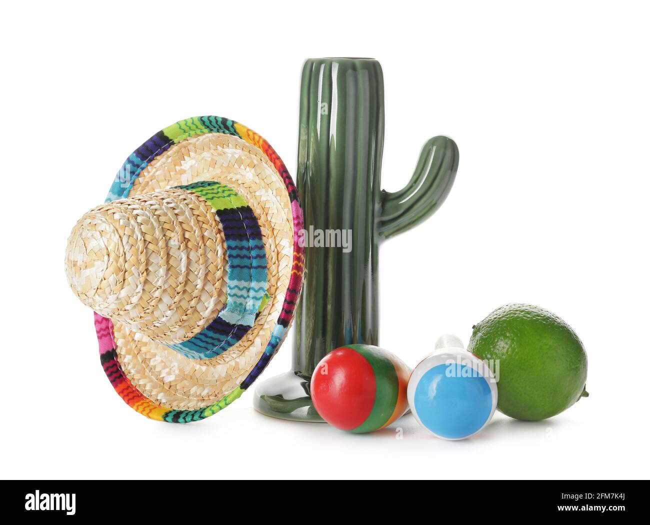 Mexican sombrero, ceramic cactus, maracas and lime on white background ...
