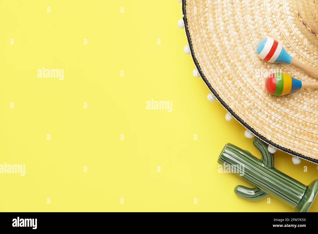 Mexican sombrero, maracas and ceramic cactus on color background Stock ...