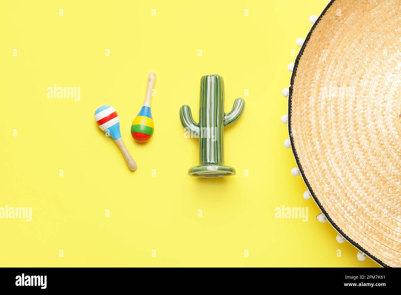 Mexican sombrero, maracas and ceramic cactus on color background Stock ...