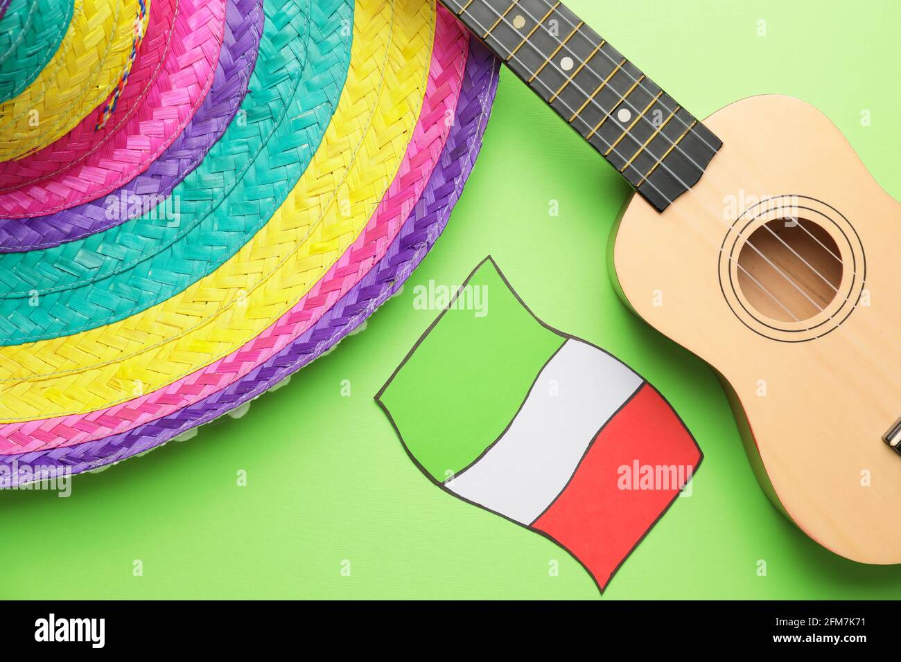 Mexican sombrero, guitar and drawn flag on color background Stock Photo ...
