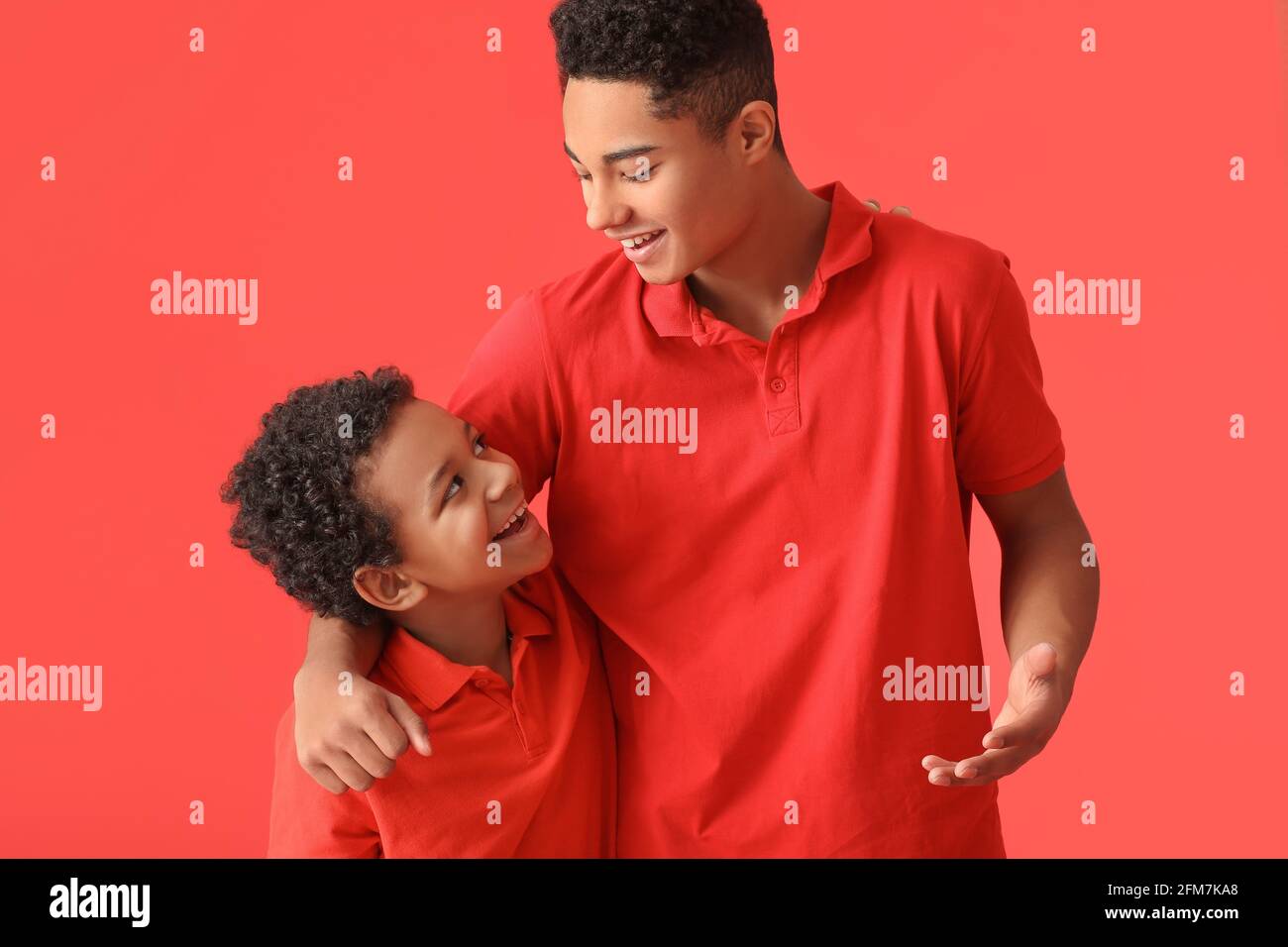 Portrait of African-American brothers on color background Stock Photo ...