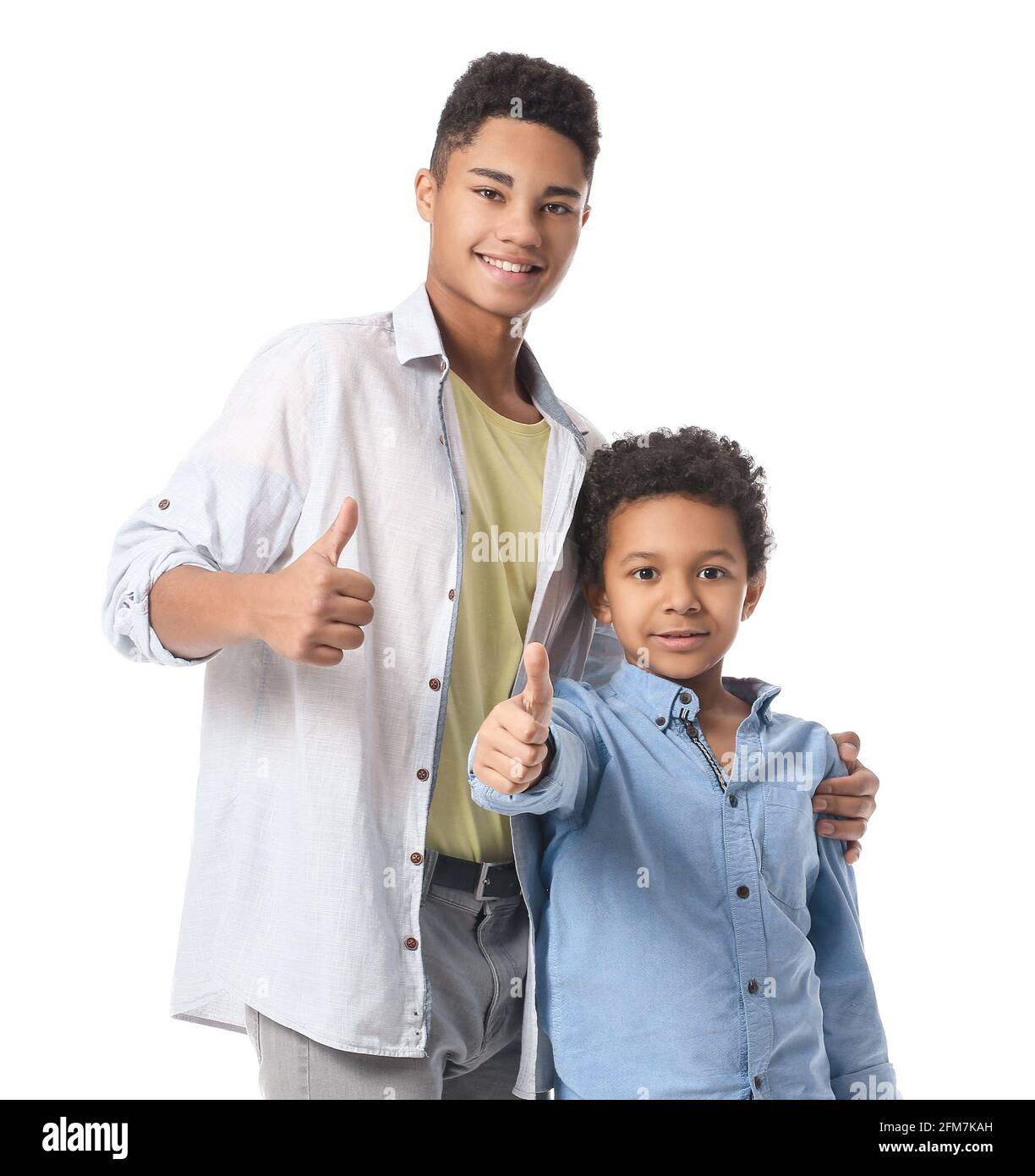African-American boys showing thumb-up on white background Stock Photo ...