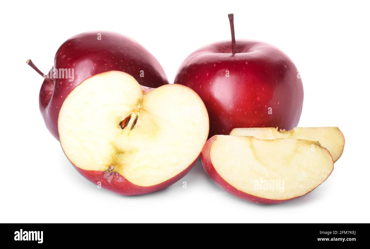Fresh red apples with pieces on white background Stock Photo - Alamy