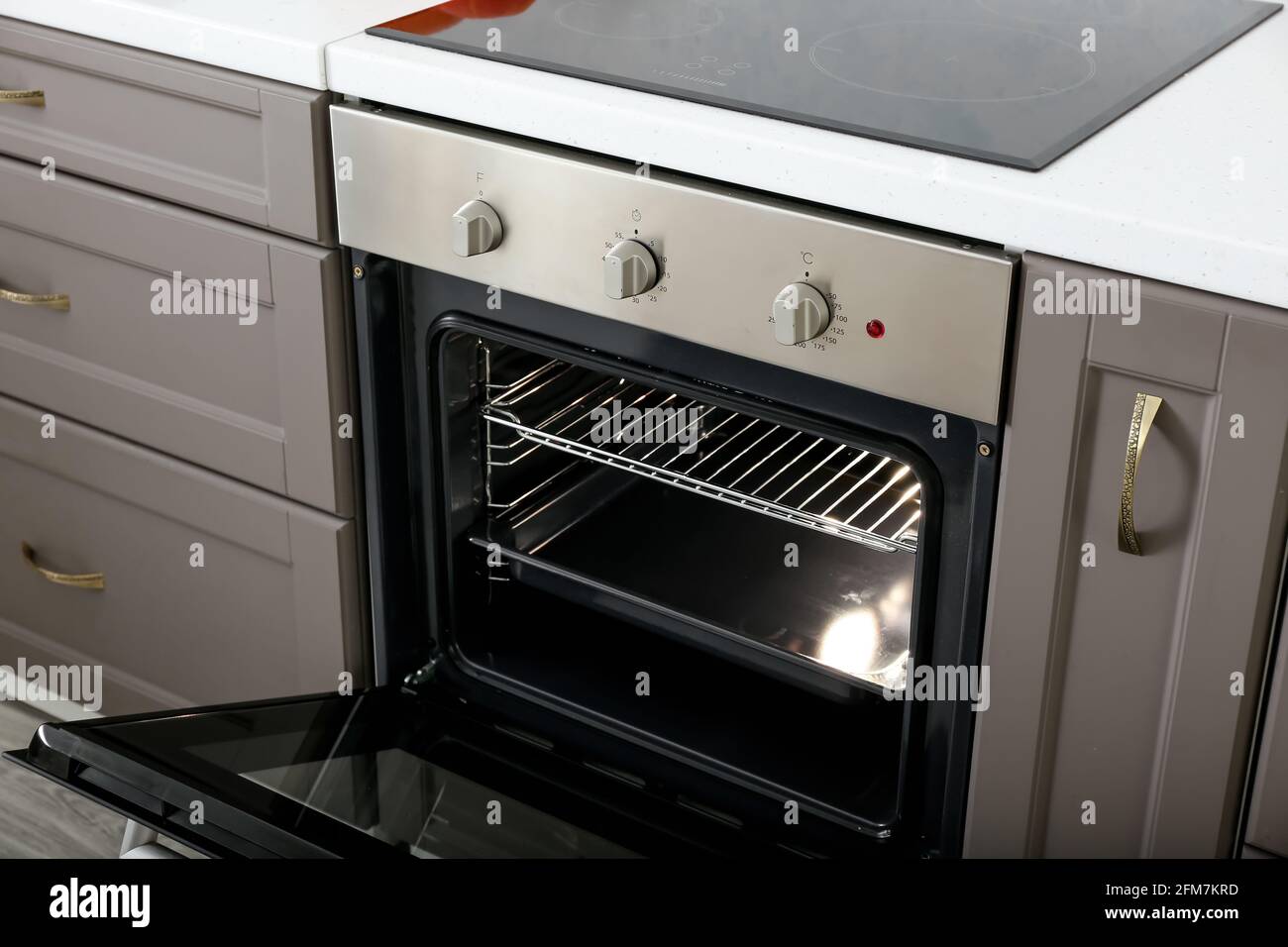 Open oven in modern kitchen Stock Photo - Alamy