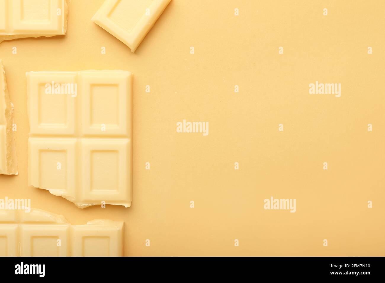 Tasty white chocolate on color background Stock Photo - Alamy