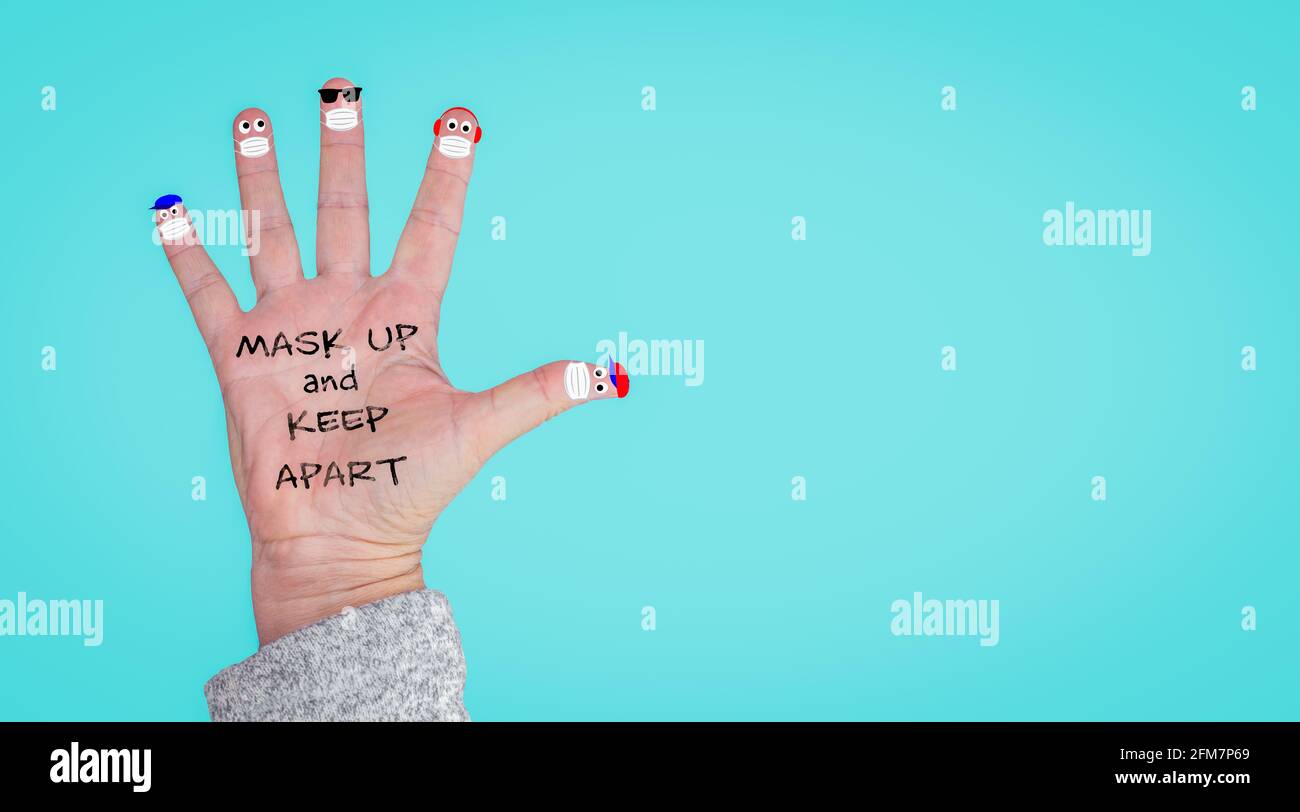 A hand with finger faces wearing face masks and keeping apart, mask up ...