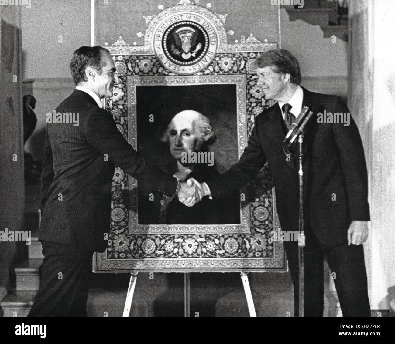 United States President Jimmy Carter, right, shakes hands with Mohammad ...