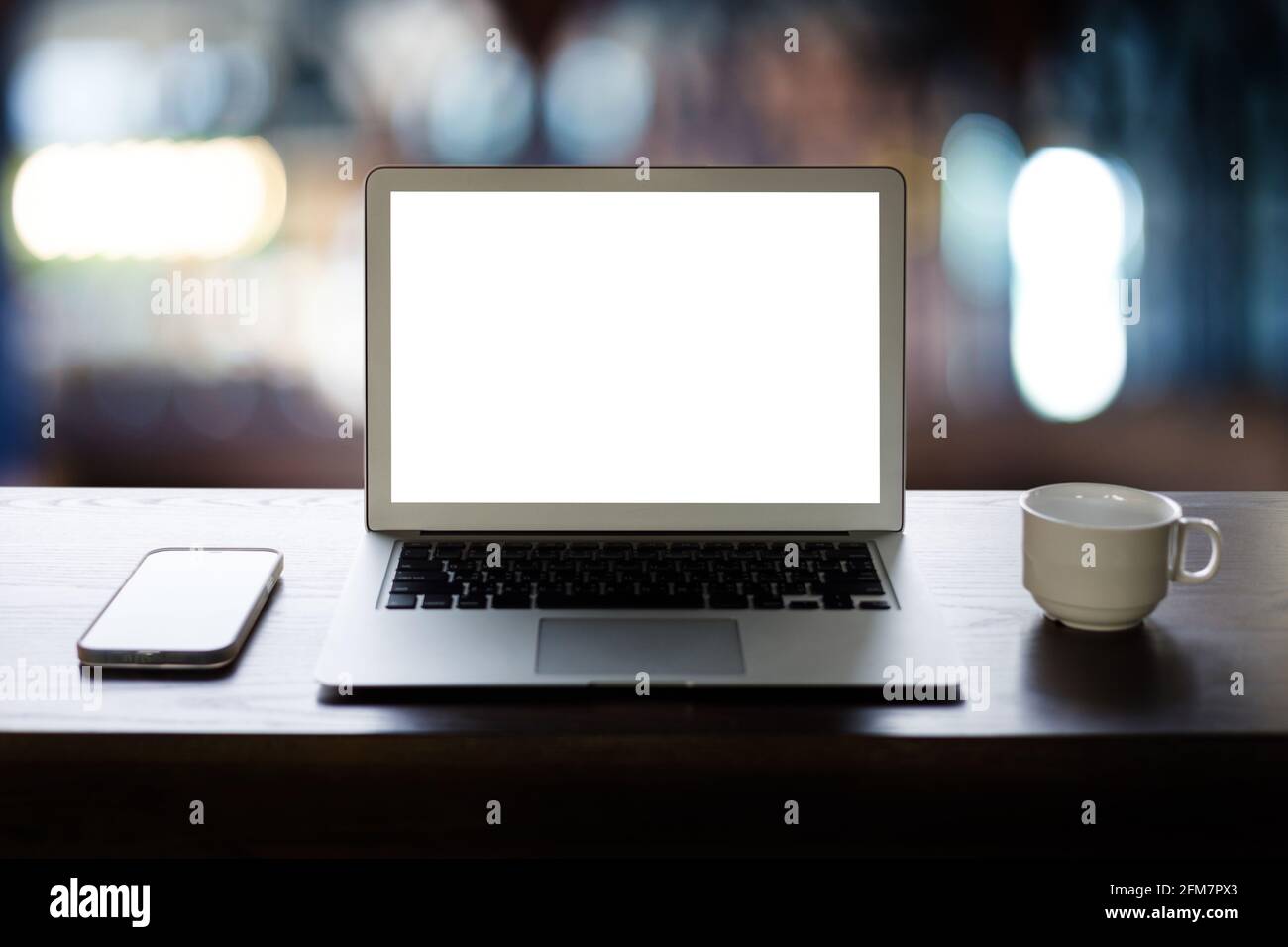 laptop computer on desk Laptop with blank screen on table in cafe ...