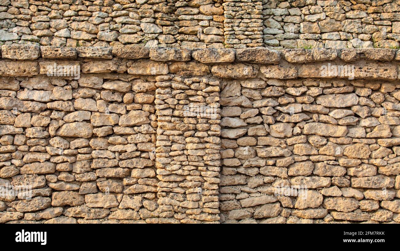 old solid wall of rough stones Stock Photo - Alamy