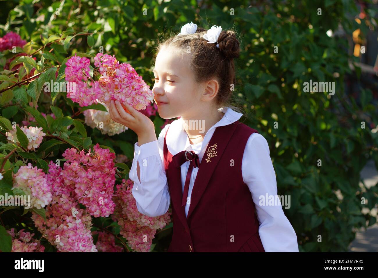 Adorable little school girl wearing uniform girl dancing and smiling ...