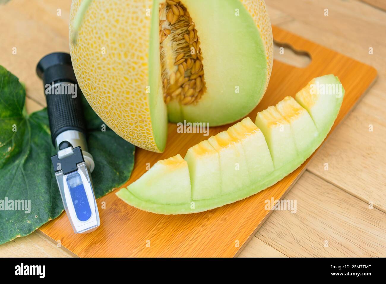 fresh yellow galia melon on the plate Stock Photo - Alamy
