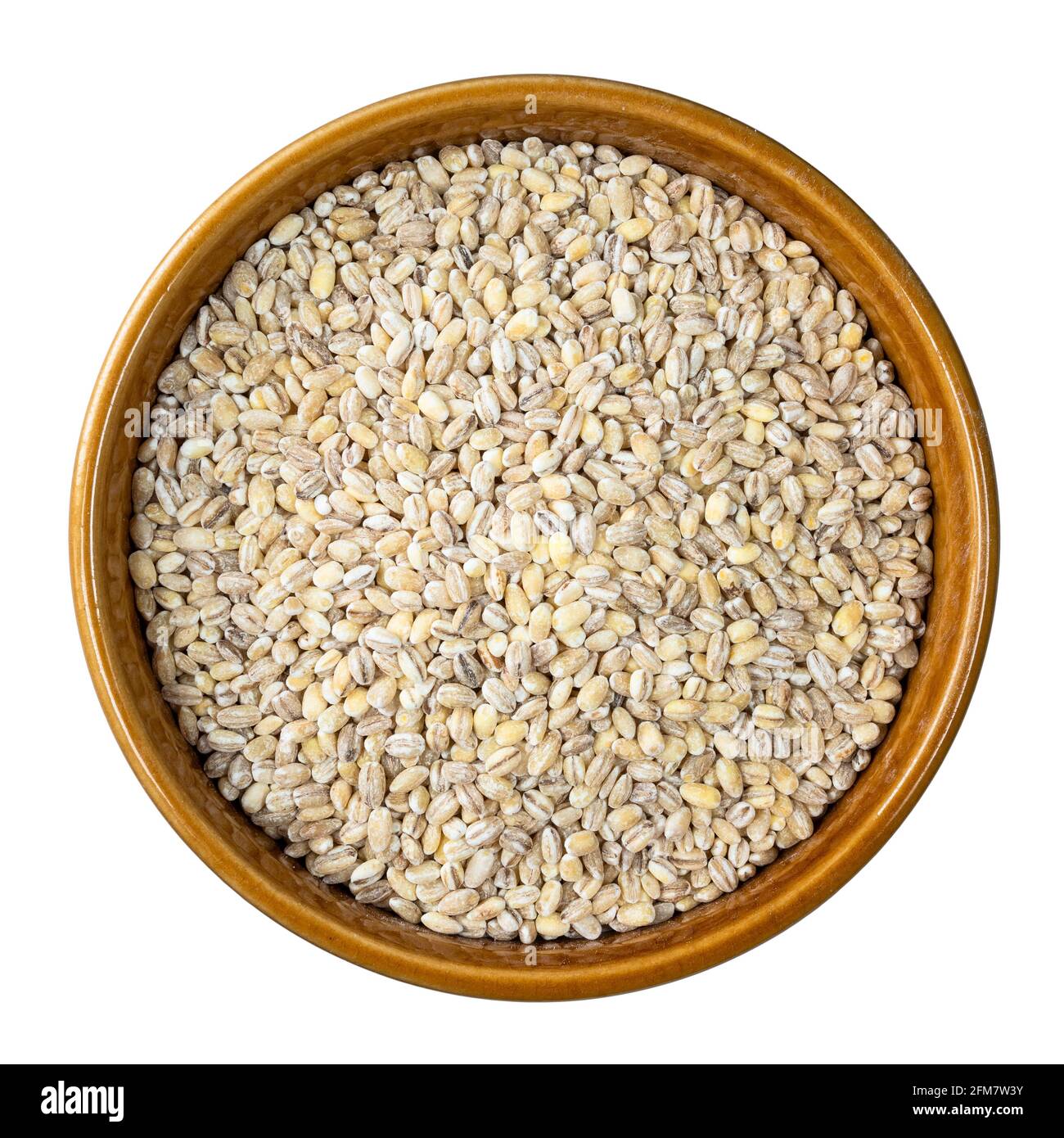 top view of raw pearl barley groats in round ceramic bowl cutout on ...