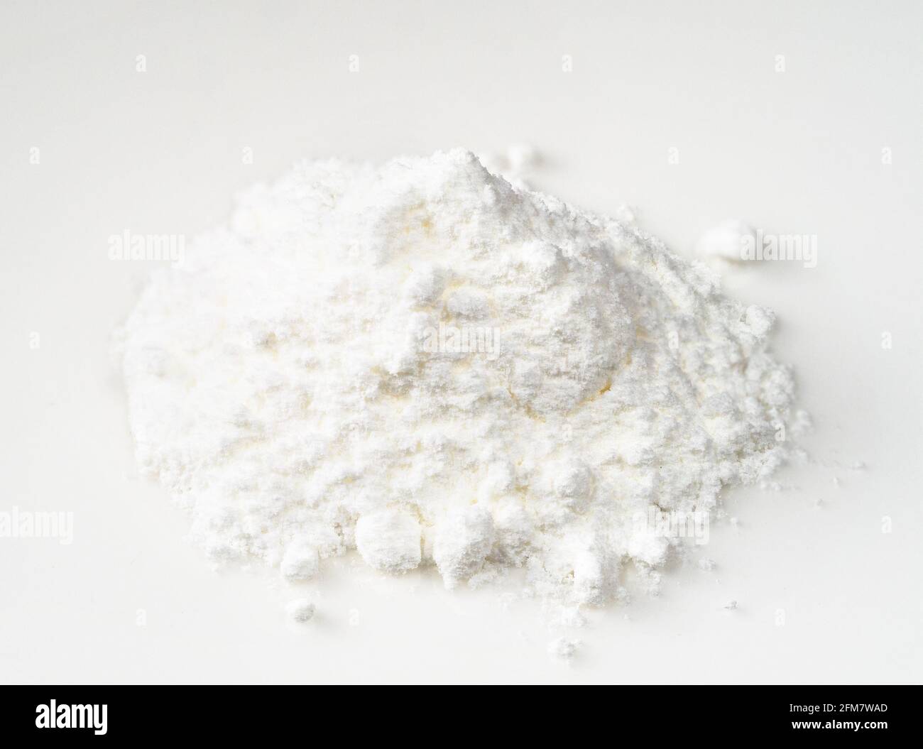 pile of baking powder closeup on white plate Stock Photo - Alamy
