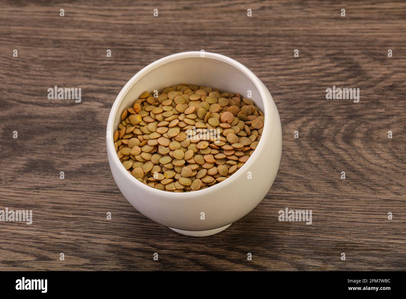 Vegan cuisine - Dry lentil heap isolated Stock Photo - Alamy