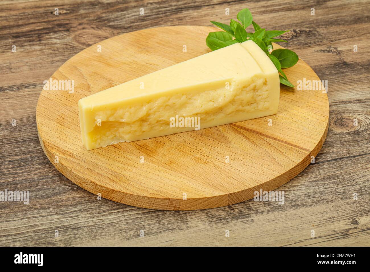Hard parmesan cheese served basil leaves Stock Photo - Alamy