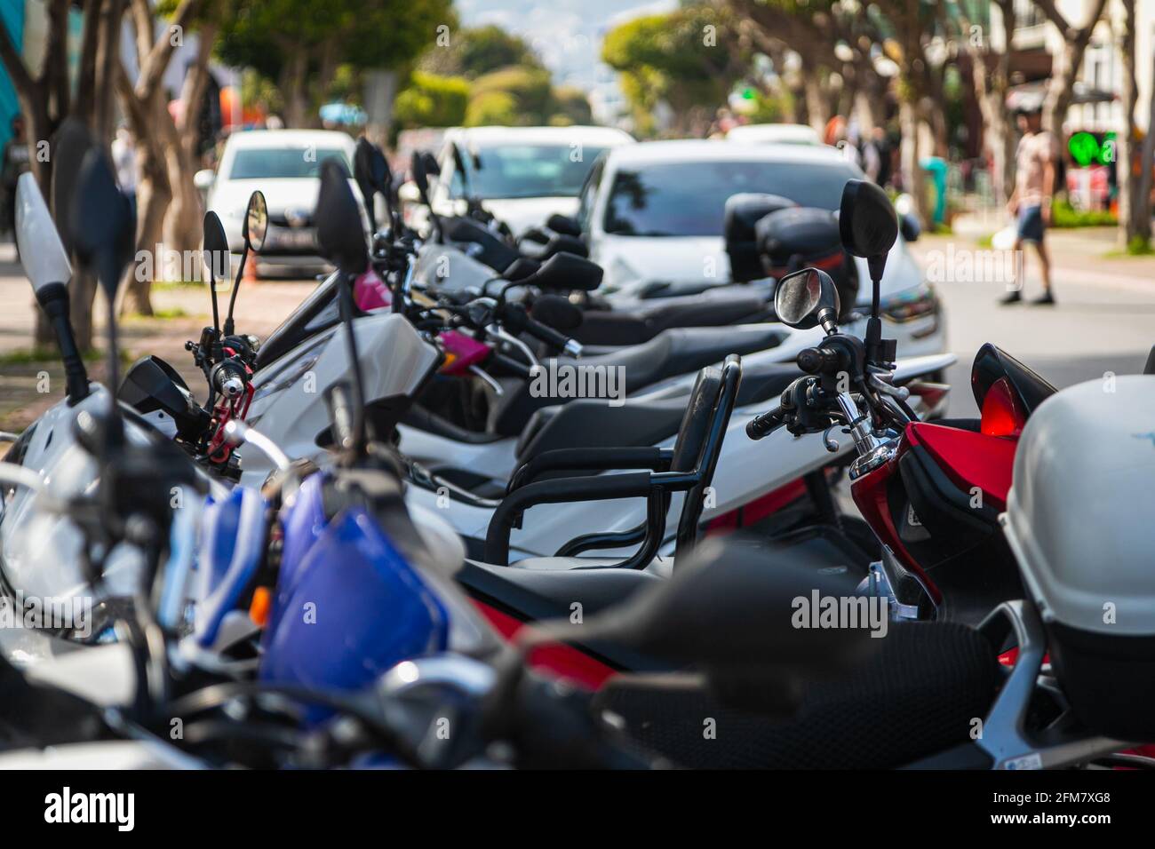 Motorcycles group parking on city street during adventure journey ...