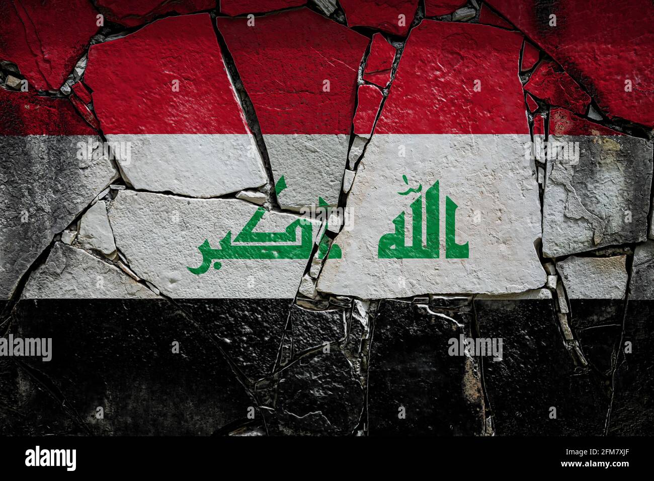 National flag of Irak depicting in paint colors on an old stone wall ...