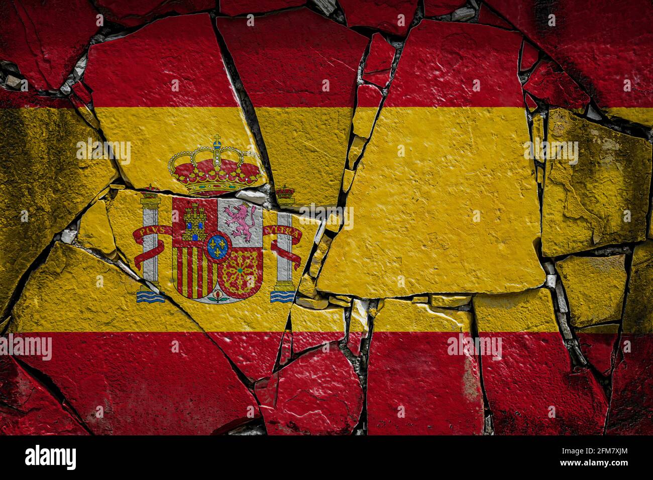 National flag of Spain depicting in paint colors on an old stone wall ...